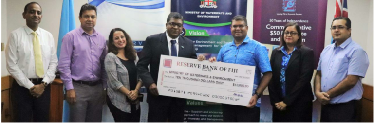 Press Release No 25 - RBF Hands Cheque to MWE - Reserve Bank of Fiji